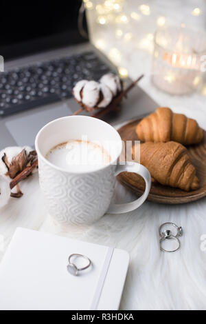 Lady bloggers white work place with business details, laptop, coffee ...