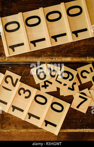 Wooden numbers in tables to learn mathematics in a Montessori classroom ...