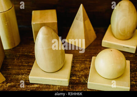 Solid wood shapes to study geometry and volumes, cones, triangles ...