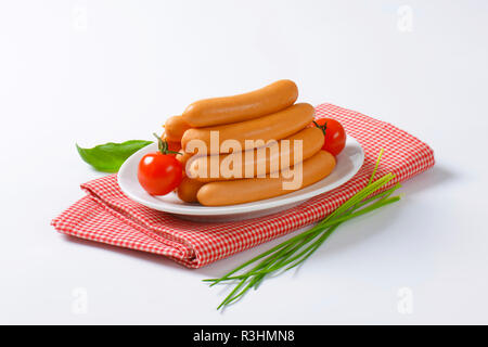 A pile of uncooked hot dog sausages individually wrapped Stock Photo ...