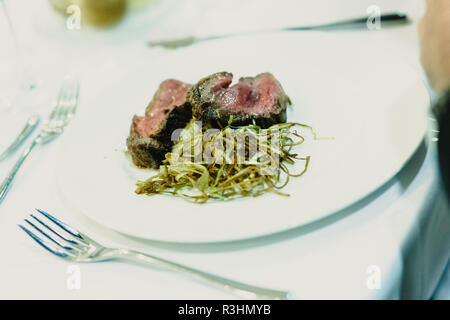 Main dish cooked with meat and garnish Stock Photo - Alamy