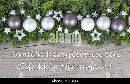 dutch Christmas card with Christmas baubles, fir branches stars and ...