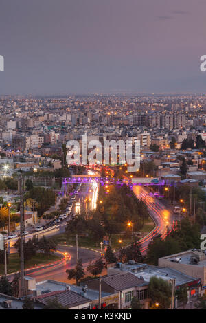 Iran, Central Iran, Shiraz, elevated city skyline from the north, dusk ...
