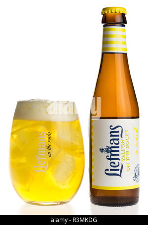 Bottle and glass of Belgian Liefmans Yelloh fruit beer isolated on a ...