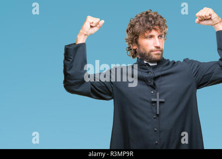 Religion concept. Handsome hispanic catholic priest man over black ...