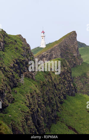 The lighthouse on Mykinesholmur, The island Mykines, part of the Faroe ...