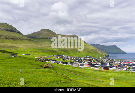 Small town Leirvik located at Leiriksfjordur. Mountains of the island ...