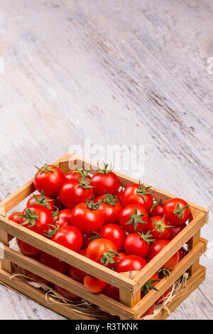 Wooden boxes full of red tomatoes collected from tomatoes farm ...