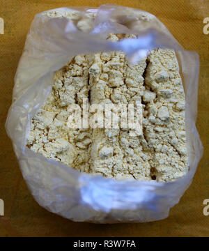 transparent plastic bag of flour, isolated on white background, blank ...