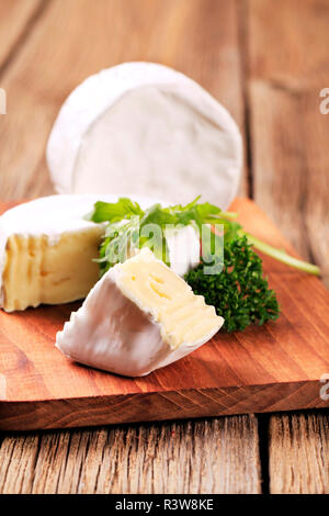 Wheel of white rind cheese - closeup Stock Photo - Alamy