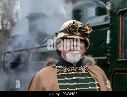 Steampunks next to a steam locomotive during the Haworth Steampunk ...