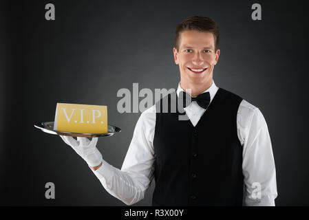 VIP Waiter Hospitality Service Staff Showing Banner Stock Photo - Alamy