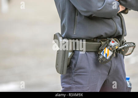 Close up of police duty belt showing handcuffs and CS gas spray Stock ...
