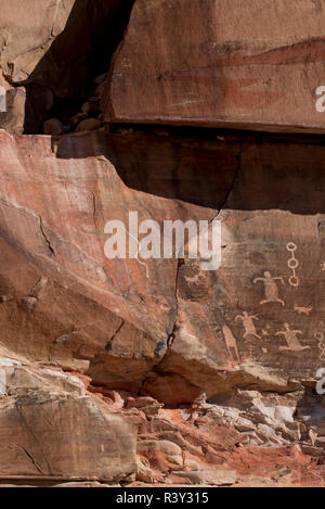 USA, Nevada. Petroglyph panel on sandstone cliff face near Falling Man ...