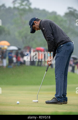 Aaron Rai of England putts on the 18th green during play offs in the ...
