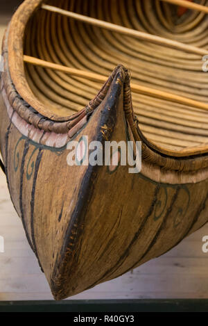 New York, Clayton. Antique Boat Museum.16 foot vintage Peterborough "all wood" canoe with wicker ...