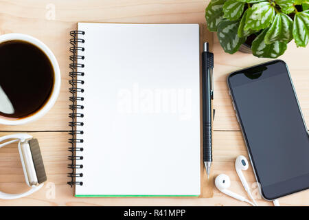 Blank note book , pencil ,watch and eyes glass on wooden background ...