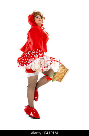 Woman dressed as Red Riding Hood in various postures in the forest ...