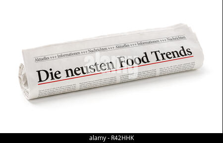 Newspaper roll with the headline The latest food trends Stock Photo - Alamy