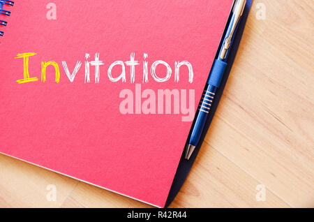 Invitation write on notebook Stock Photo - Alamy