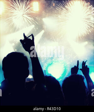 New year concept - cheering crowd and fireworks Stock Photo - Alamy