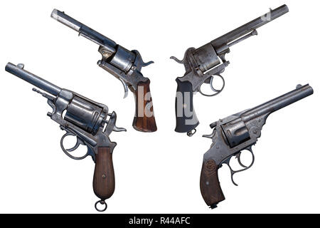 Ancient weapon. Four old revolvers isolated Stock Photo - Alamy