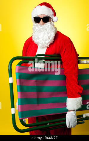 Photo of positive bearded santa claus sit sleigh raise hand wave palm ...