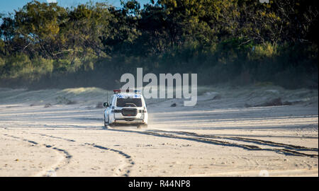 Police 4WD driving along the beach Stock Photo - Alamy
