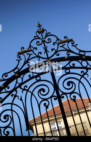 Stylish wrought iron gate and stone pillars Stock Photo - Alamy