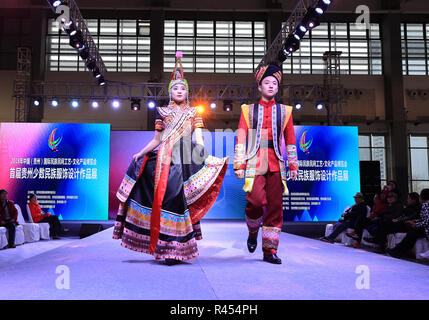 Guizhou, China. 25th Nov, 2018. Models present traditional clothes of ...