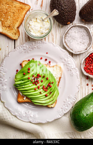 Sandwich with avocado and cottage cheese. Sliced avocado on bread Stock ...