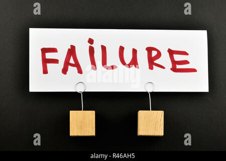 Failure, One big paper note red on black Stock Photo - Alamy