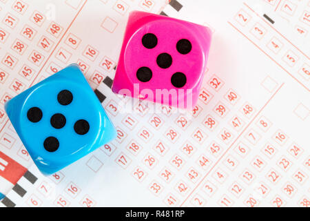 Close up of dice and lottery ticket Stock Photo - Alamy