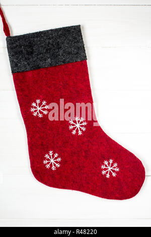 red christmas sock with snowflakes for Santa gifts on white background ...