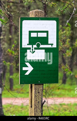 A green sani-dump sign with a direction arrow Stock Photo - Alamy