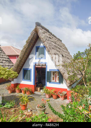 A typical house in the Santana style with a straw covered roof in the ...