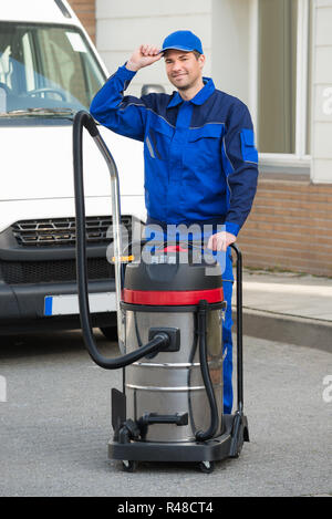 Janitor Wearing Cap While Standing On Street Stock Photo - Alamy
