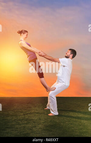 Delighted nice couple doing sports activities together Stock Photo - Alamy