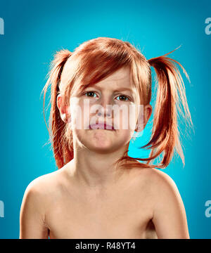 The beautiful portrait of displeased and disaffected little girl on ...