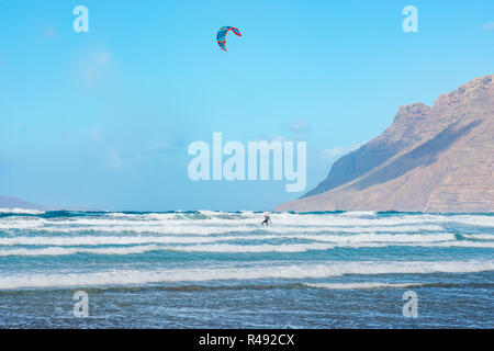 Kitesurfing in Caleta de Famara, in Lanzarote, Canary Islands, in Spain ...