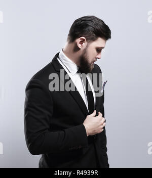 Confidence and charisma. Handsome young man looking away with smile and ...