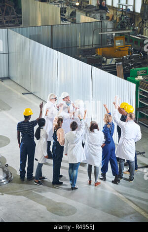 Group of Emotional Factory Workers Stock Photo - Alamy