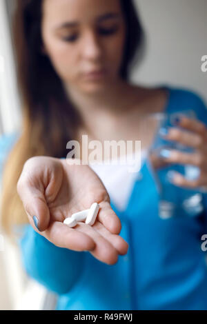 Depressed teenager with pills Stock Photo - Alamy