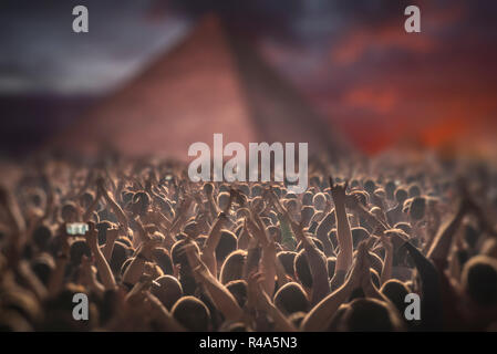 concert in the Pyramids of Egypt. A crowd of people celebrating a ...