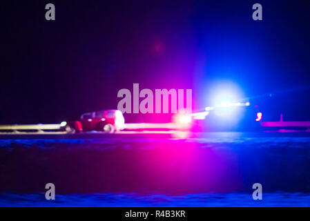 Traffic police officer with mobile speed camera on tripod checking ...