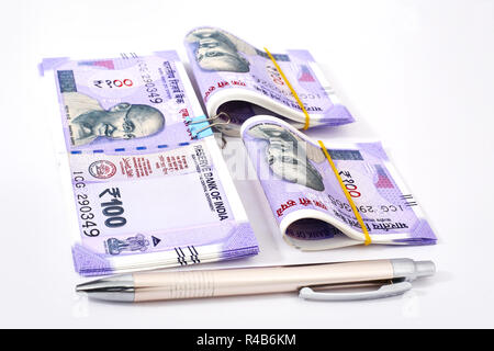 Indian currency ; bundle of 100 rupees notes ; counting with lady ...