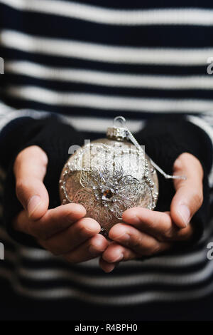 Young caucasian man wearing christmas hat holding credit card over ...