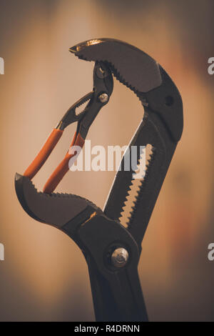 image of an adjustable pliers pipe wrench on white Stock Photo - Alamy