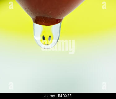 Macro of a happy smiley refraction in a water drop Stock Photo - Alamy