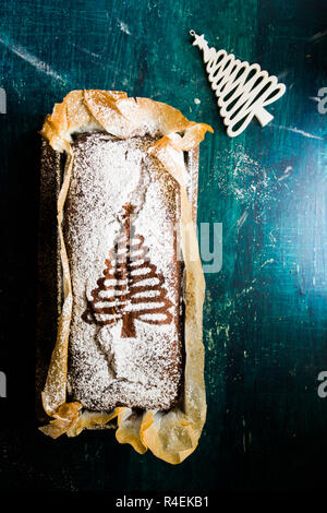 Chocolate banana bread decorated with a christmas tree on top , various ...